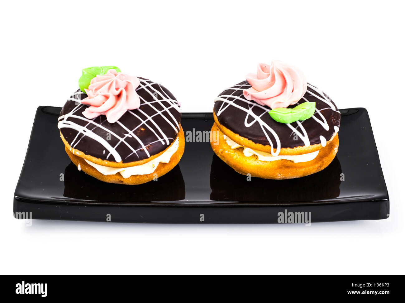 Colorful biscuits cakes bush with icing and custard filling. Studio ...