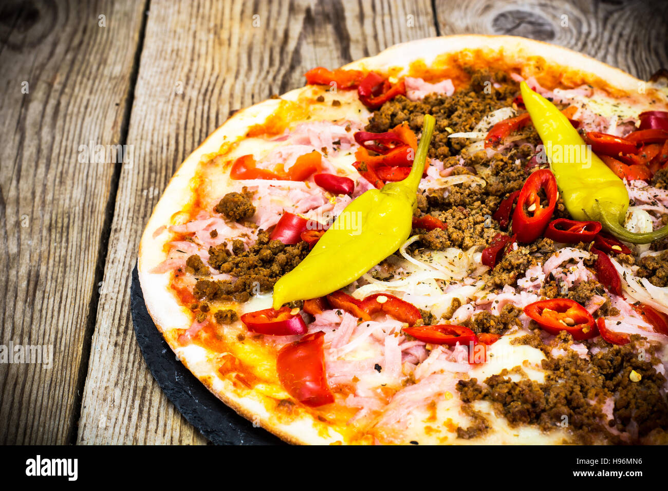 Rustic Italian Pizza on a Thin Pastry with Minced Pork, Ham, Tomatoes ...