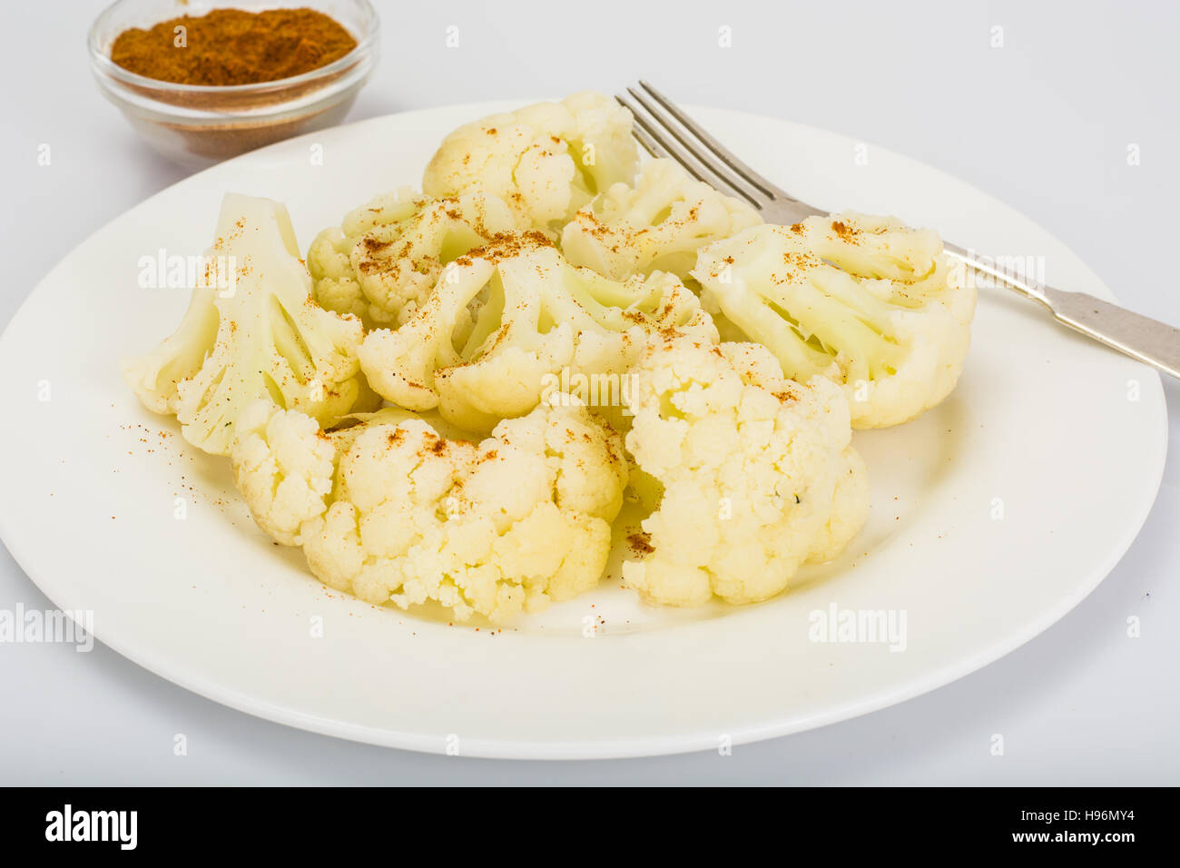 Cauliflower Boiled with Curry on Plate. Studio Photo Stock Photo - Alamy
