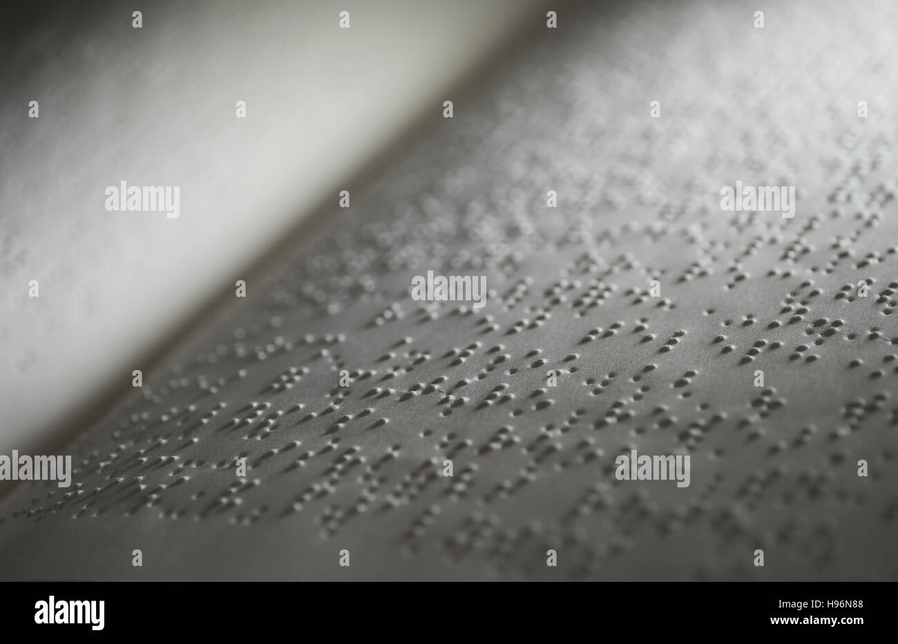 Book with Braille text Stock Photo - Alamy