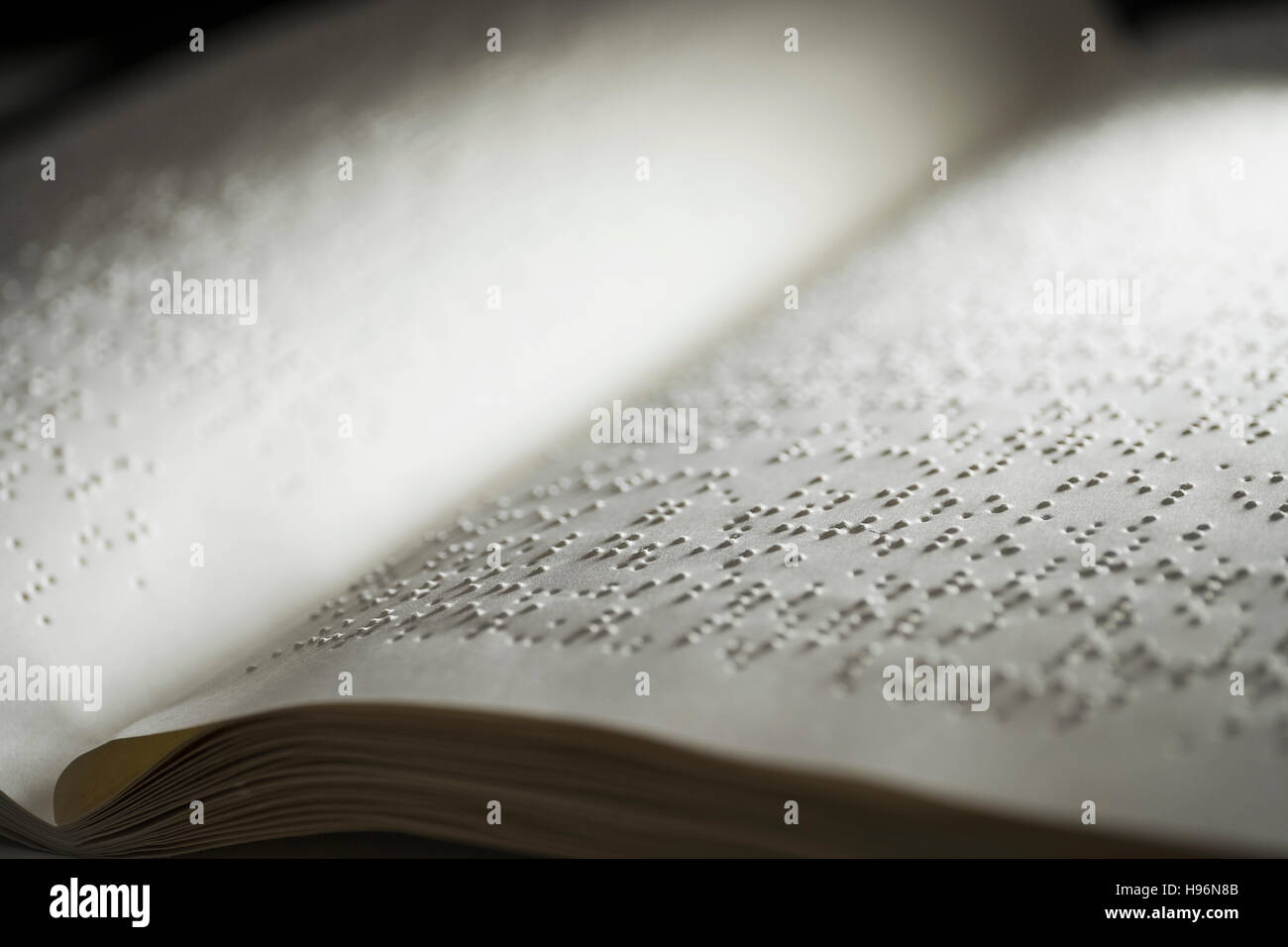 Book with Braille text Stock Photo - Alamy