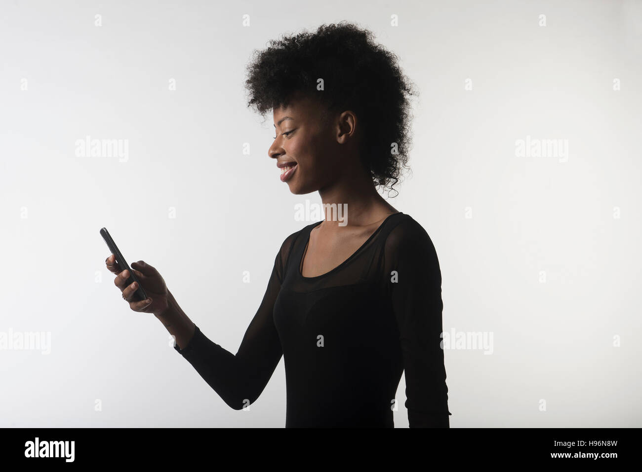 Trendy woman mobile white background hi-res stock photography and ...