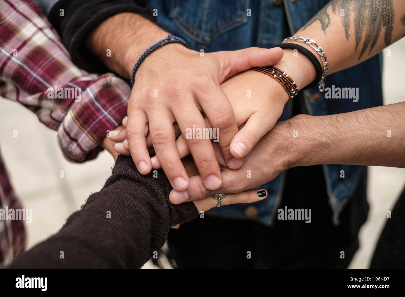 Stack of hands, friends holding hands outdoors Stock Photo - Alamy