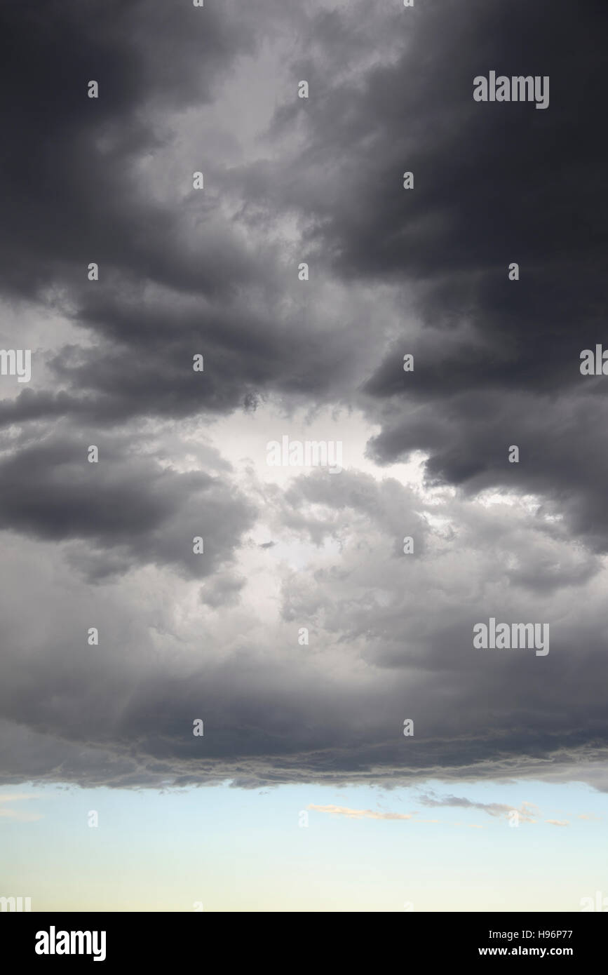 Storm clouds gathering on late evening sky Stock Photo - Alamy