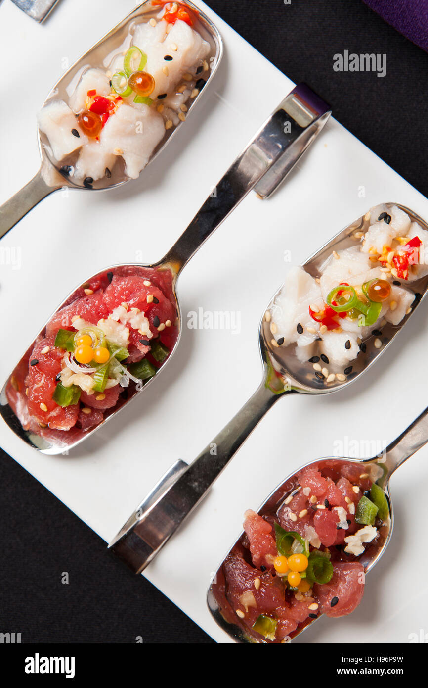 Sushi on metal spoons Stock Photo - Alamy