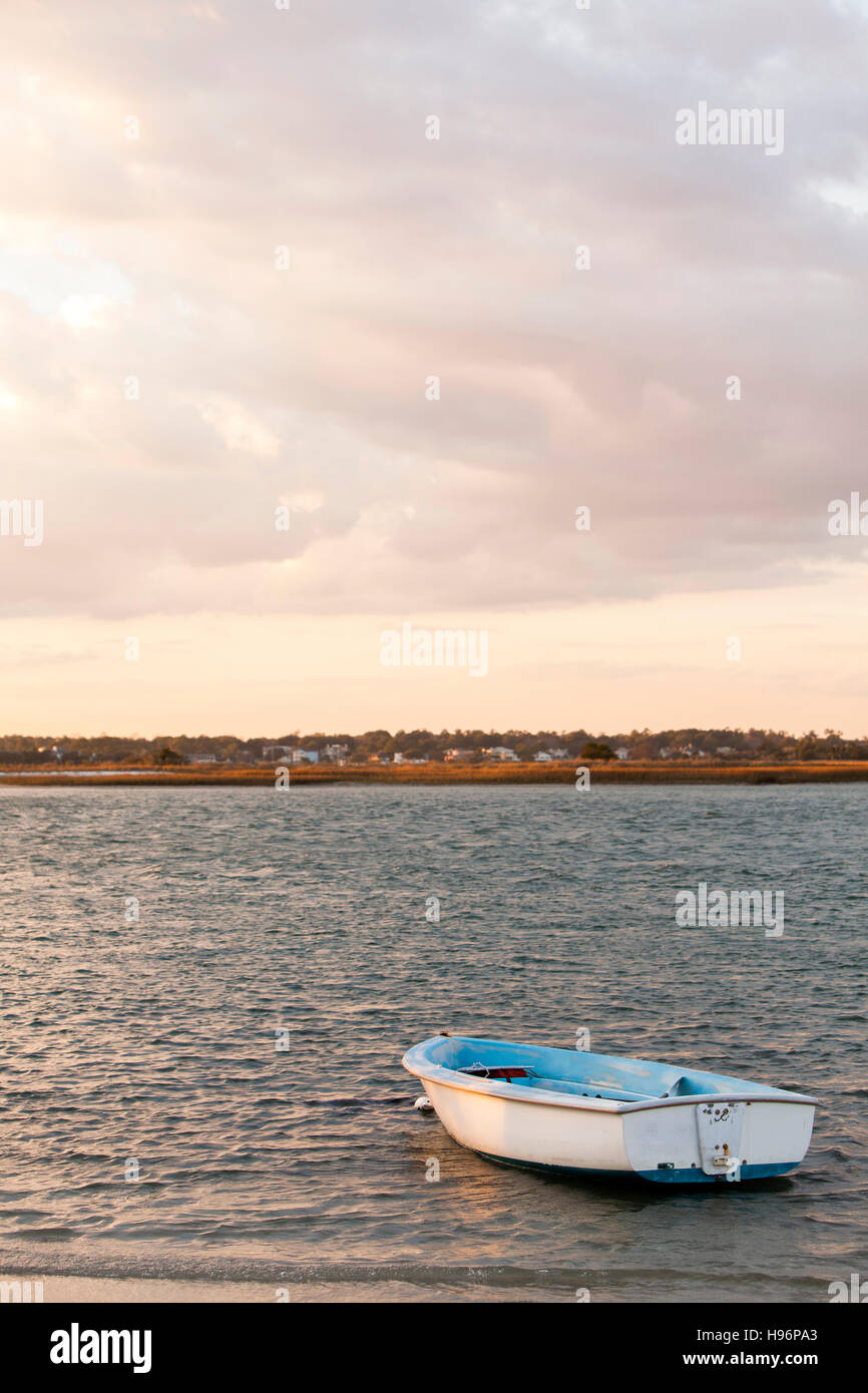 Empty boat in water Stock Photo - Alamy