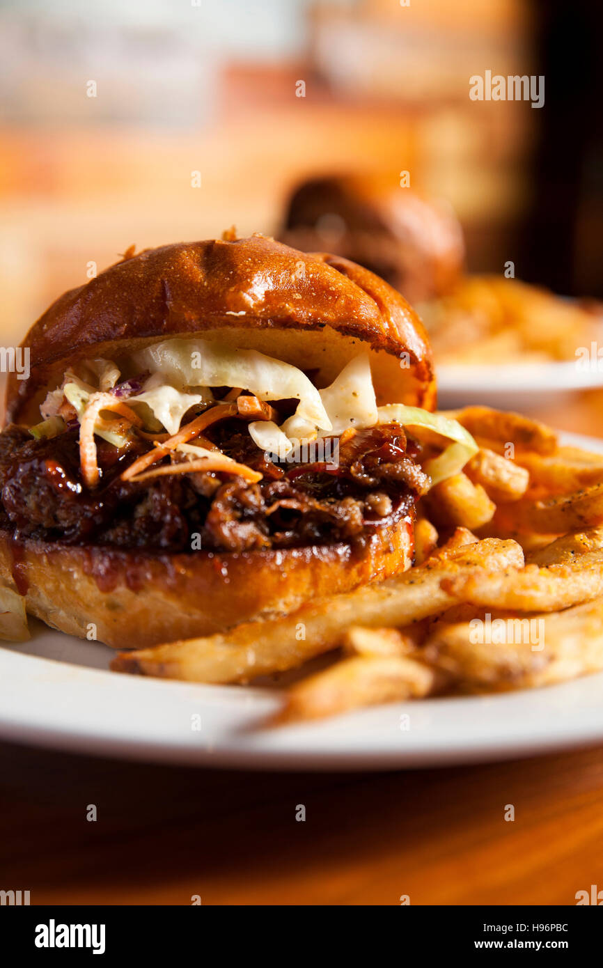 Barbecue sandwich witch coleslaw and french fries Stock Photo - Alamy
