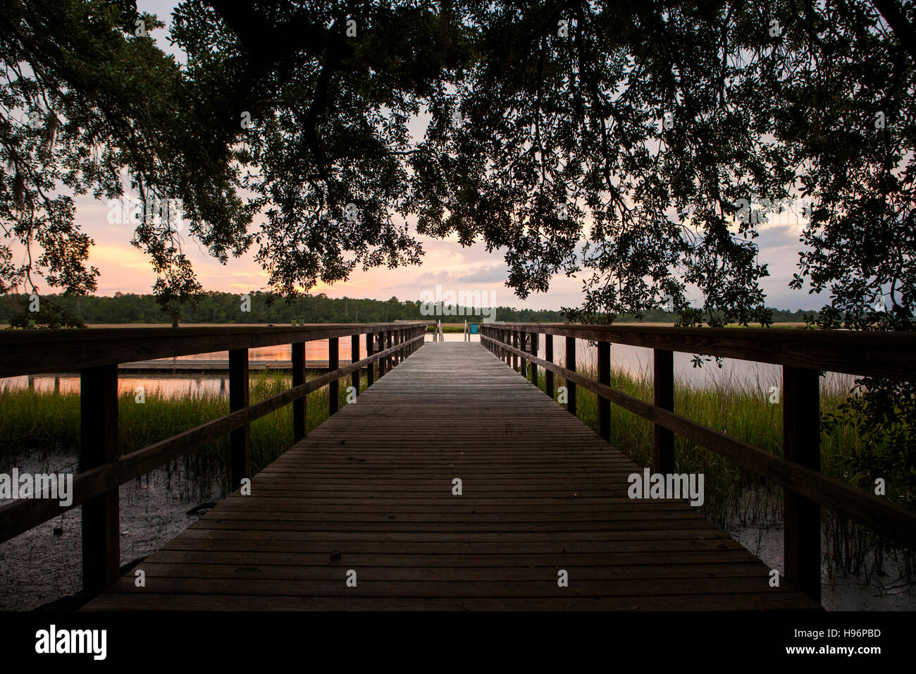 Jetty at sunset Stock Photo - Alamy