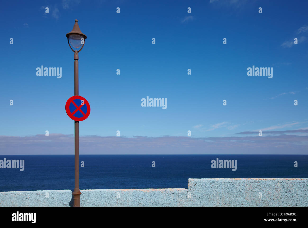Blue wall, lantern and traffic sign at the Atlantic in Bajamar ...