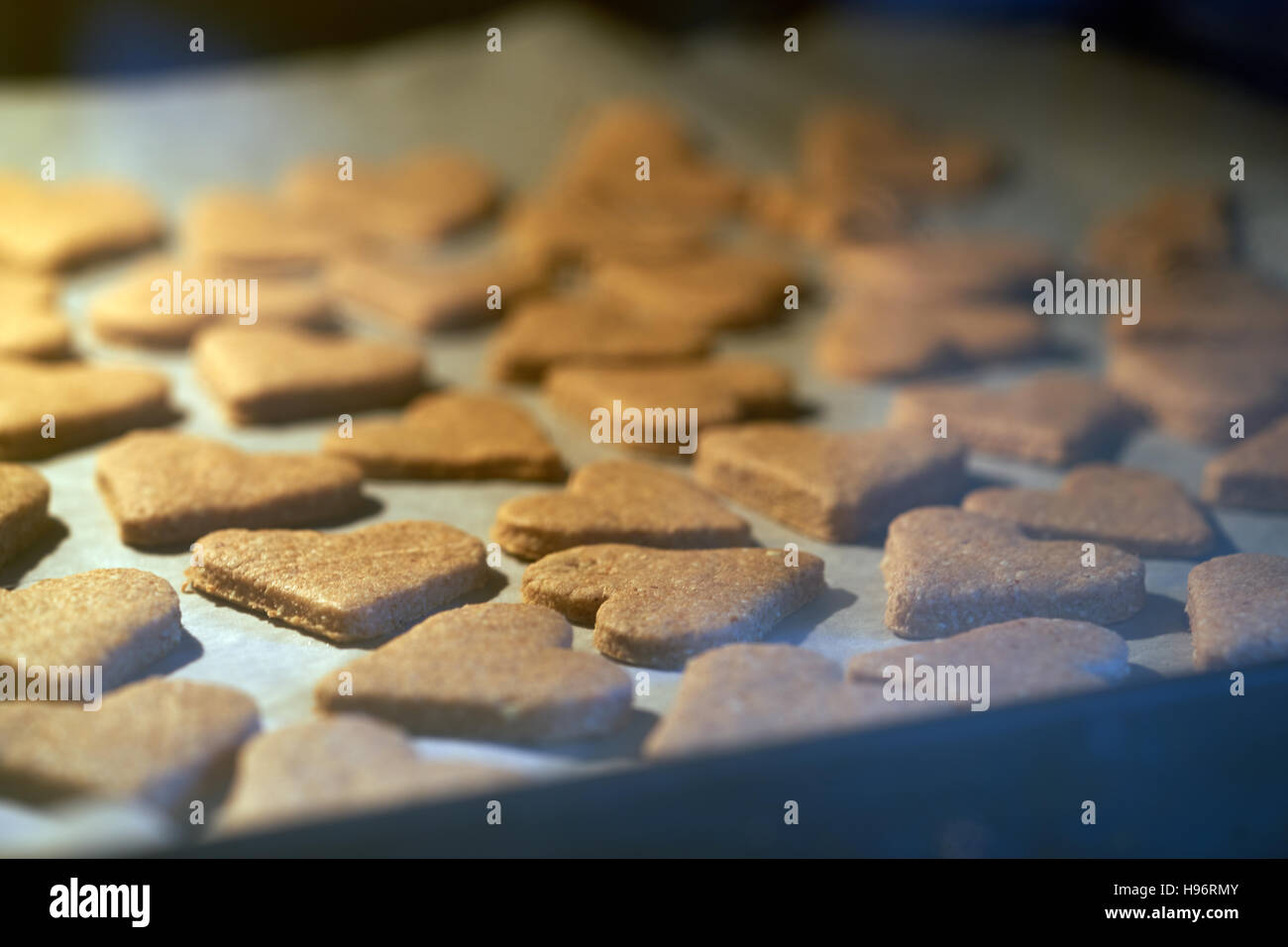 Cookies in the Oven with blurred Background Stock Photo - Alamy
