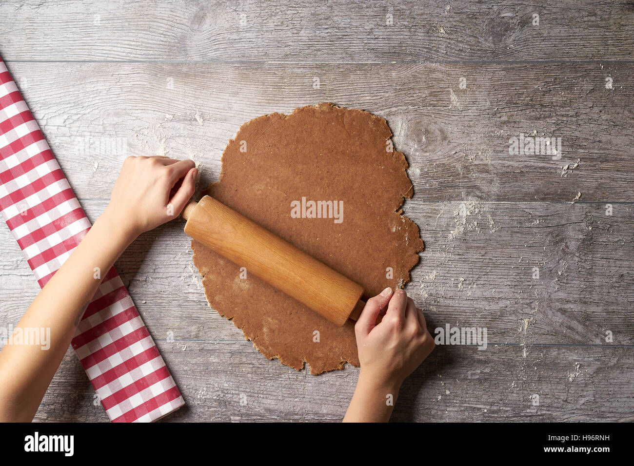 Hands rolling out Gingerbread dough from above, sideways in Stock Photo ...