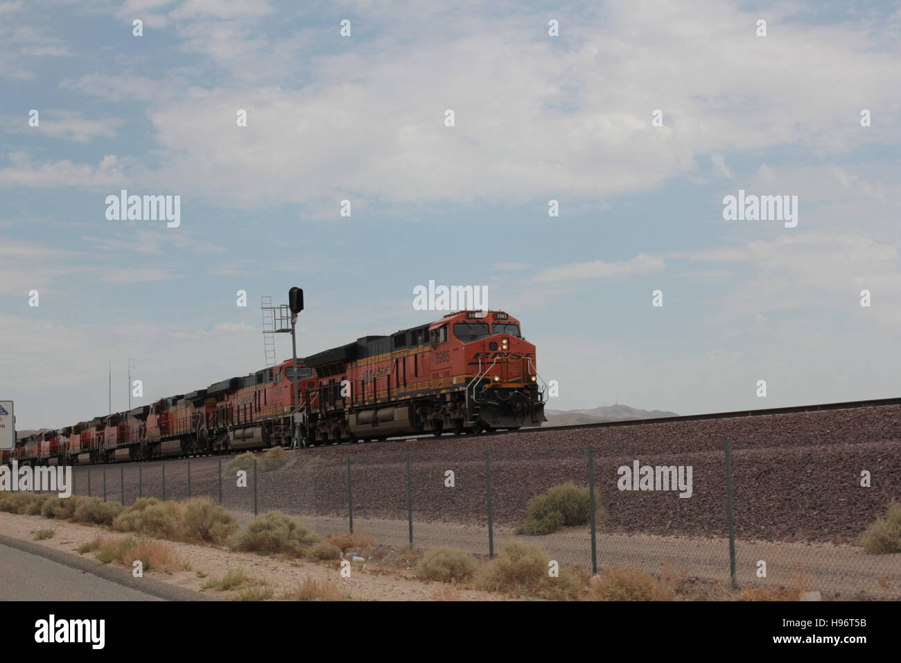 Red diesel train transporting industrial goods Stock Photo - Alamy