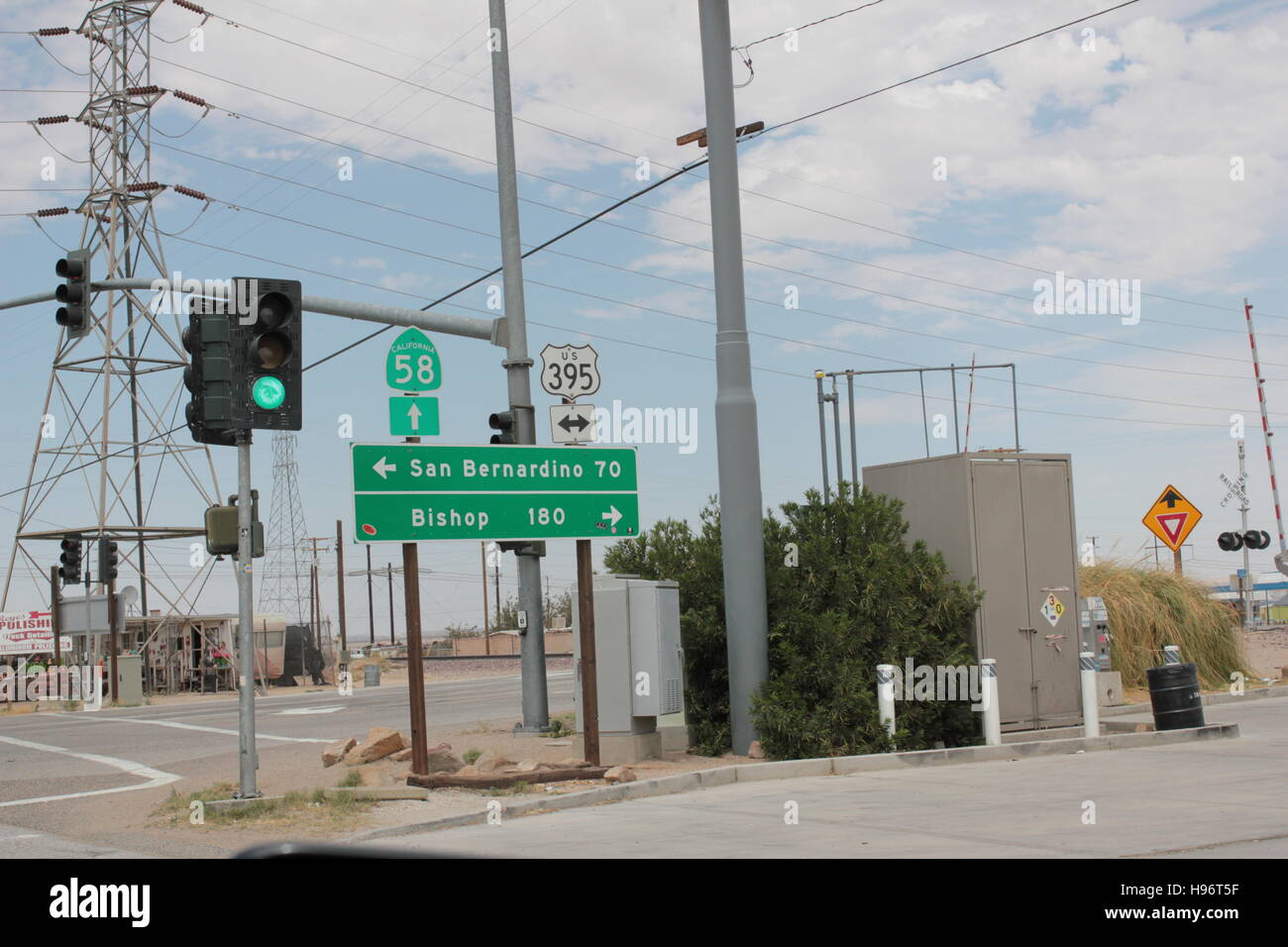 Road sign and industrial on highway 58, Mojave desert Stock Photo - Alamy