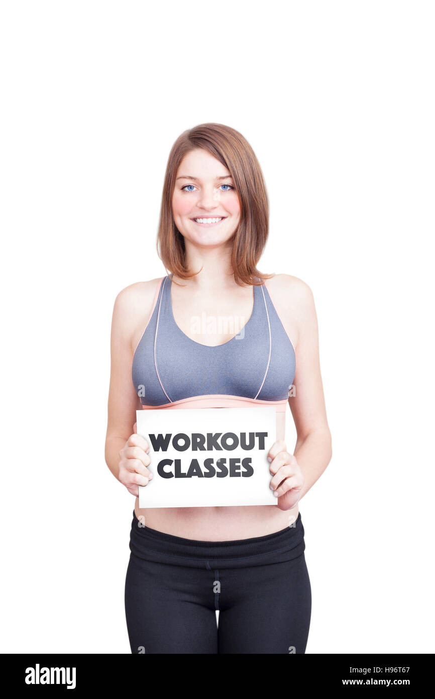 Sporty young woman holding sign Stock Photo - Alamy