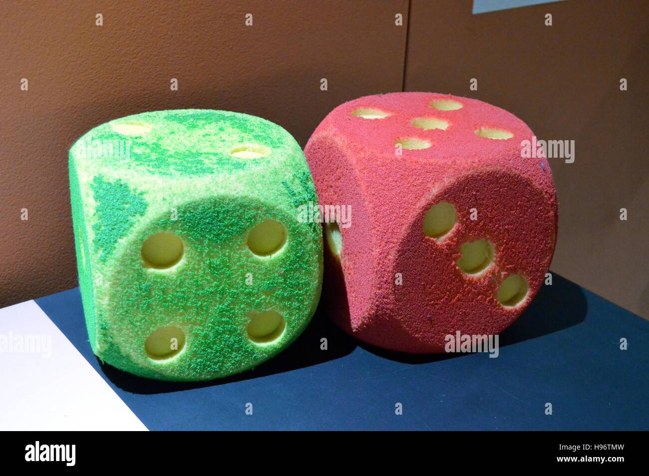 Pair of dice to play in green and red on a blue background Stock Photo ...
