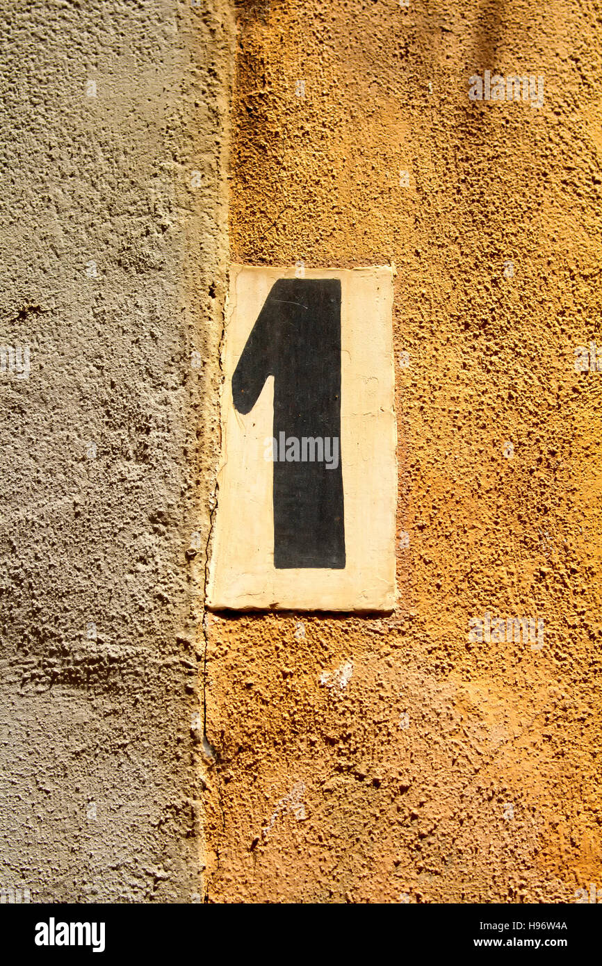 View of engraved building number (1) on historical plaster surface in ...