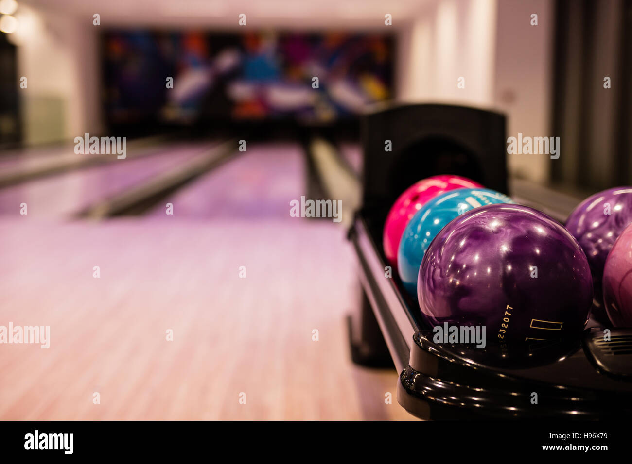 Bowling balls and wooden lane in bowling hall Stock Photo - Alamy