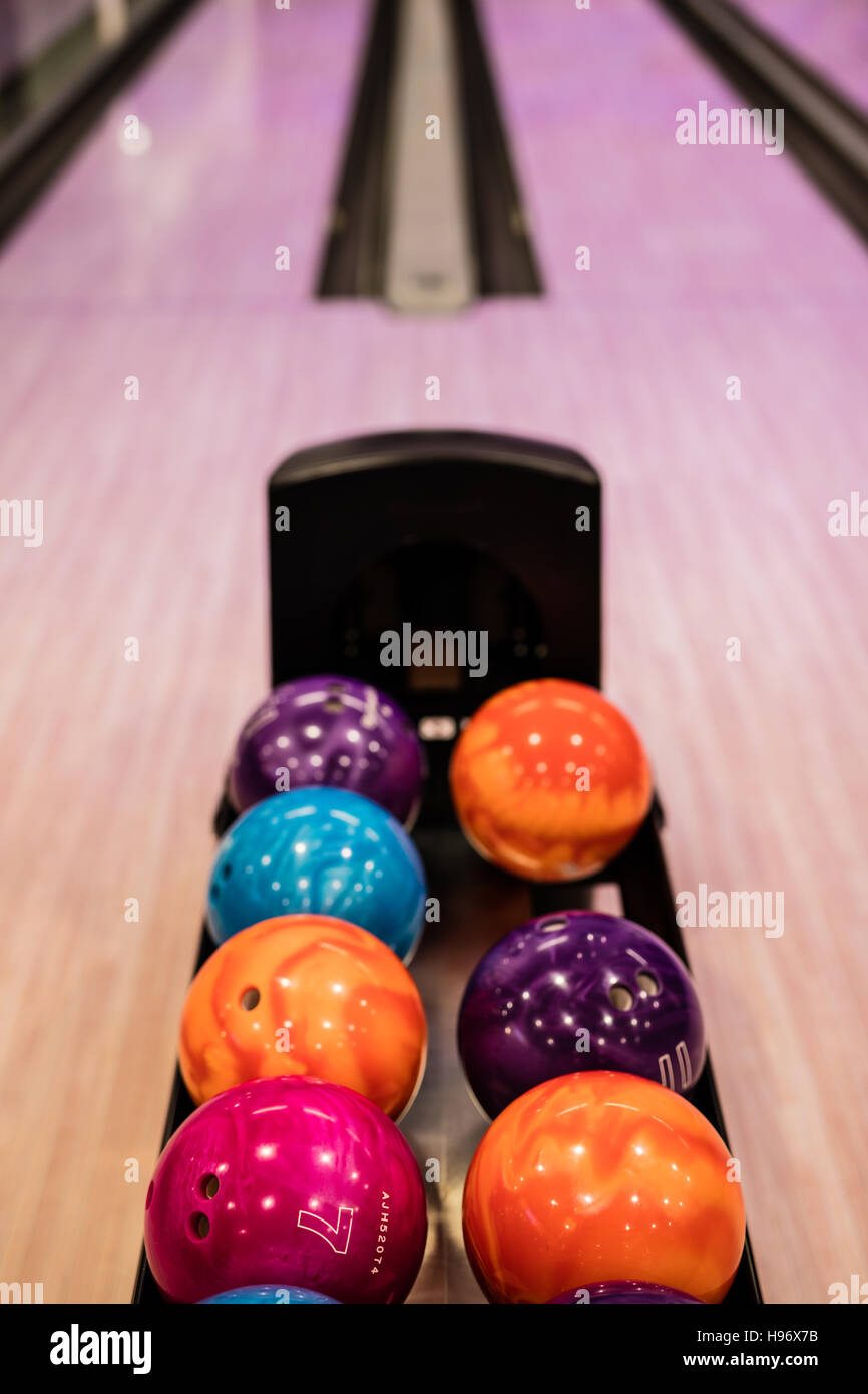 Bowling balls and wooden lane in bowling hall Stock Photo - Alamy