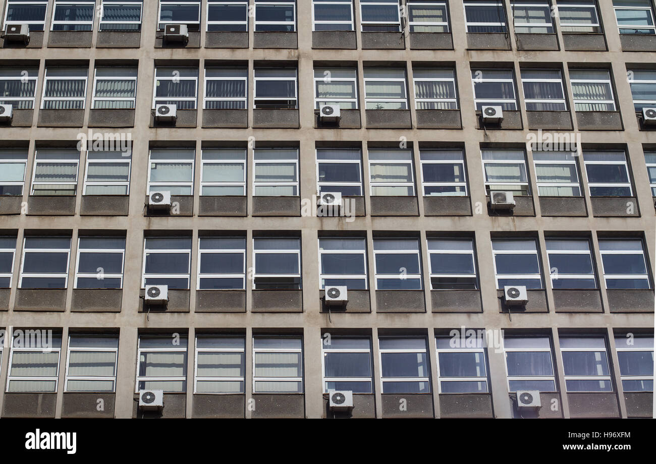 Horizontal front view old of industrial office building windows with ...