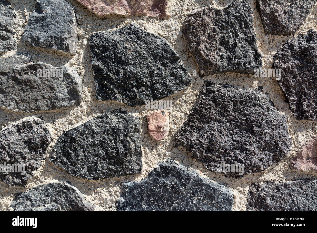 Closeup of volcanic stone wall in Santorini, Greece Stock Photo - Alamy