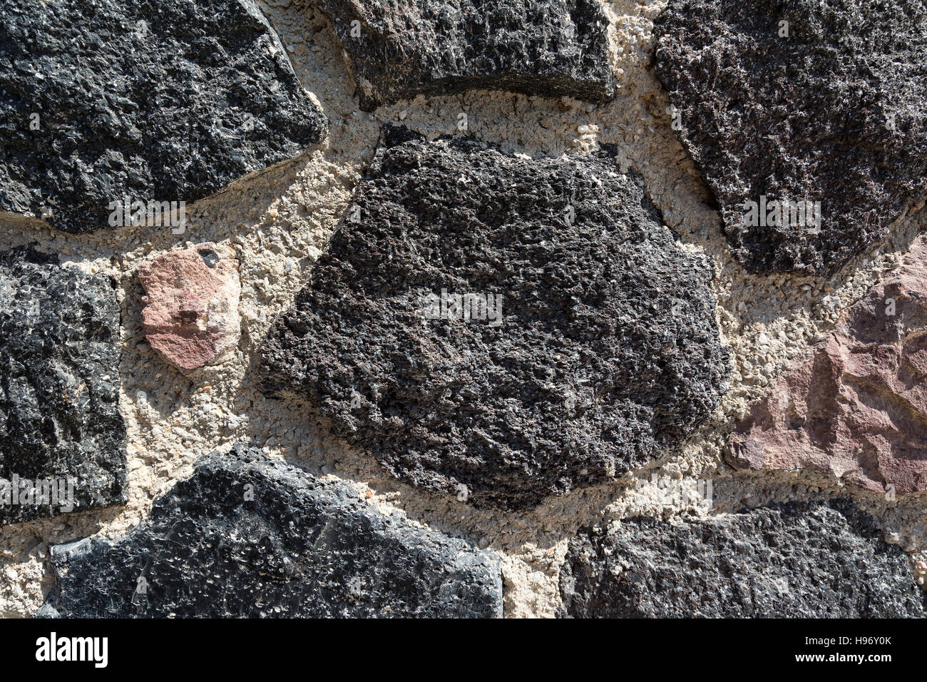 Closeup of volcanic stone wall in Santorini, Greece Stock Photo - Alamy