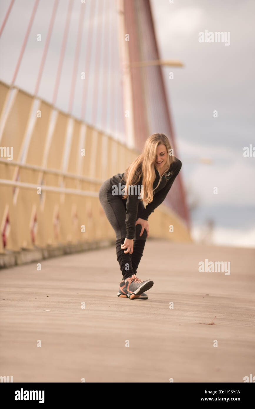 Beautiful woman standing on walk bridge Stock Photo - Alamy