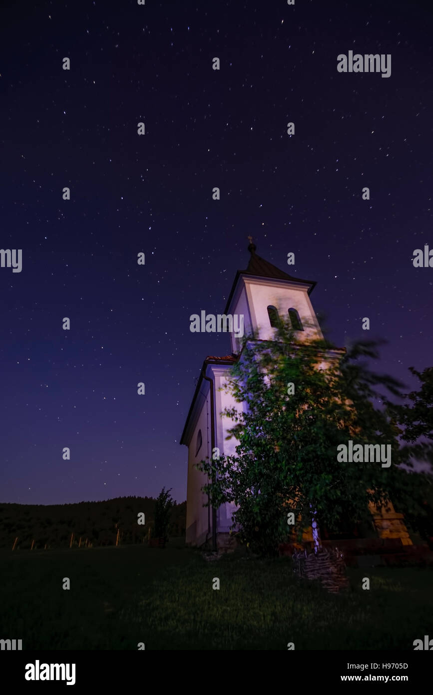 Church in clear, starry night with Ursa Maior - Big bear to the left ...