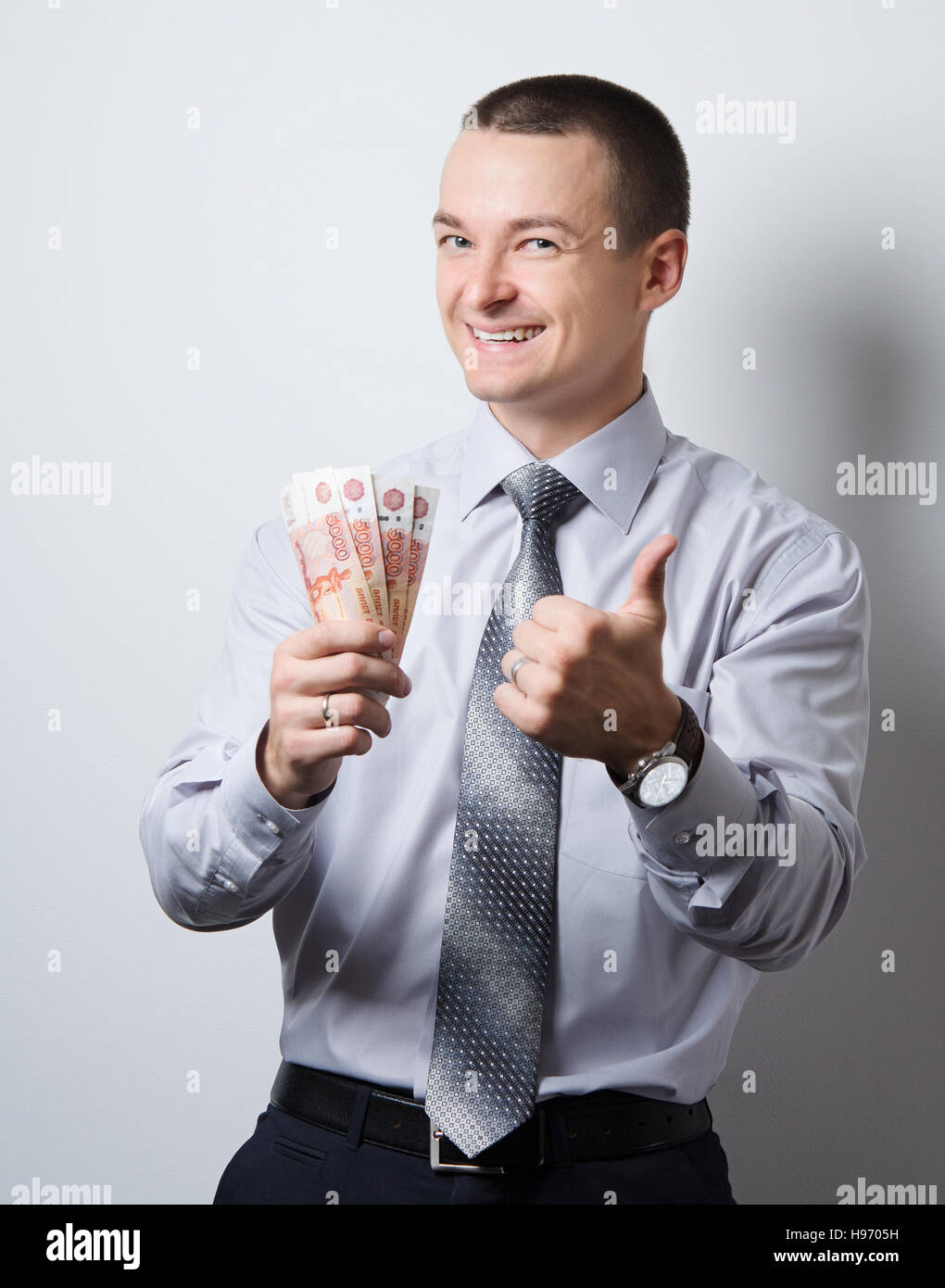 Manager offers money cash Stock Photo - Alamy