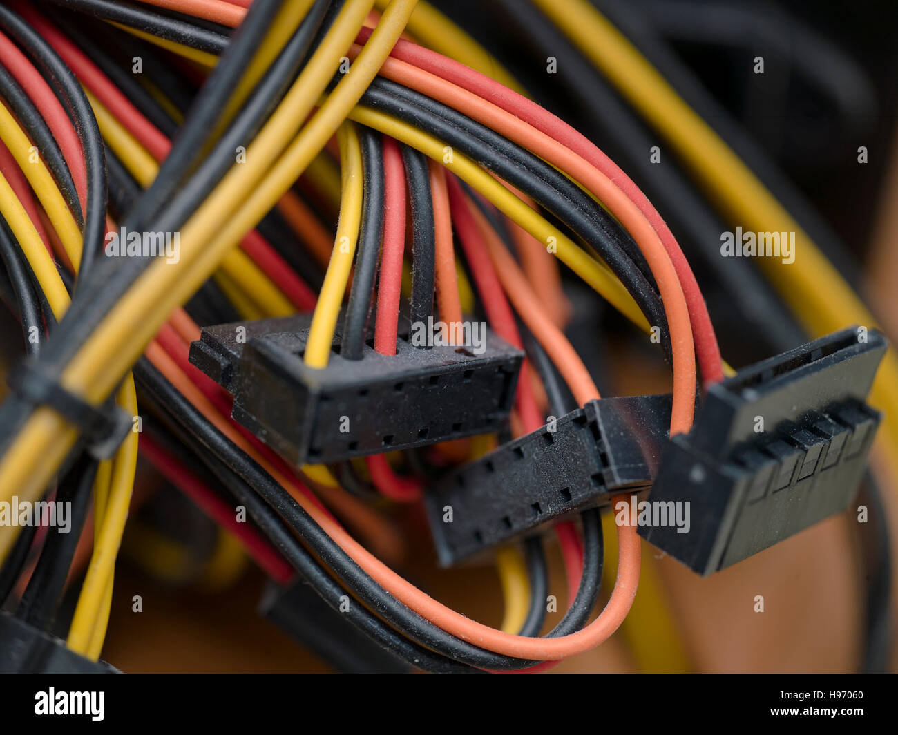 Bunch of multicolor computer cables in mess, shallow depth of field ...