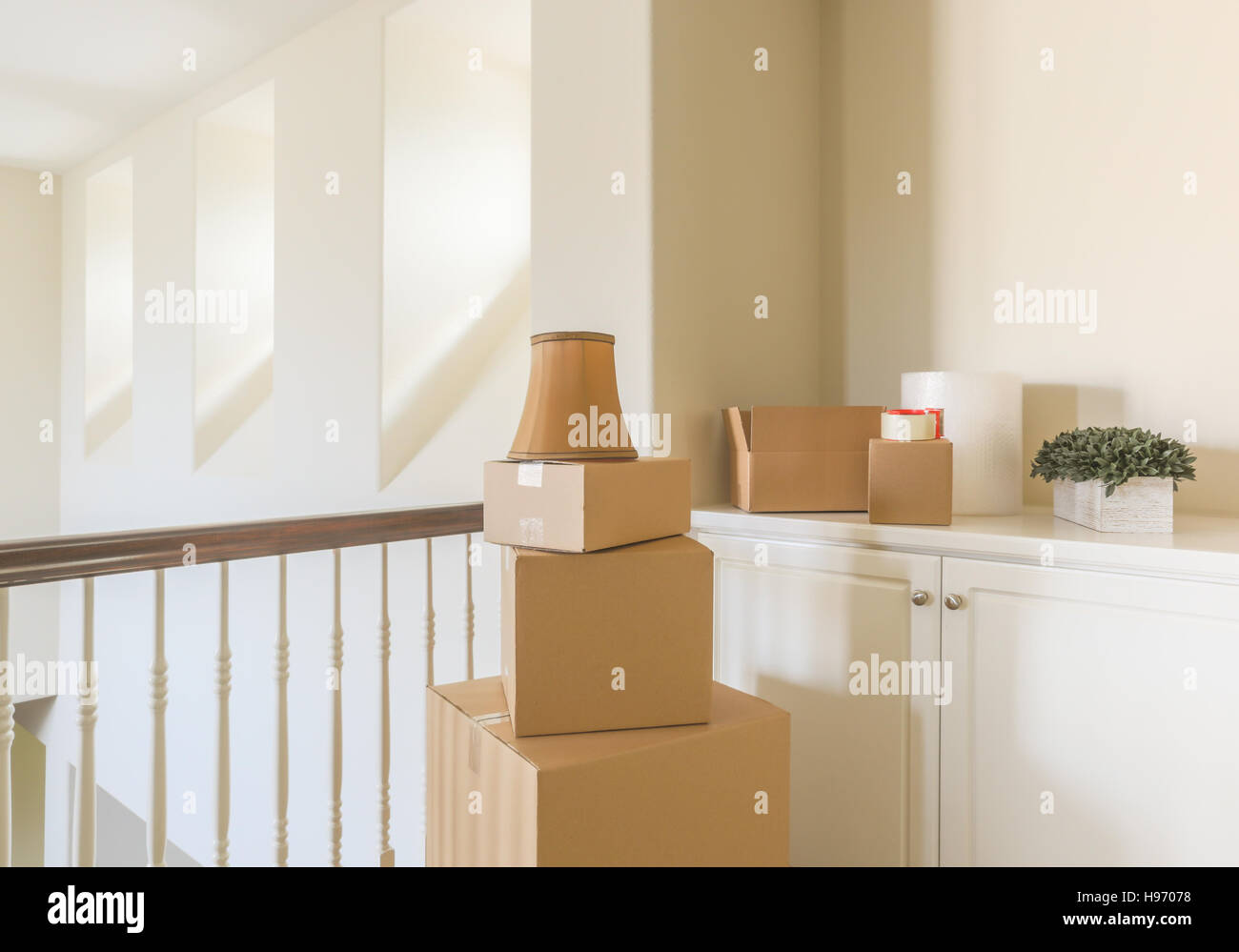 Variety of Packed Moving Boxes and Materials In Empty Room Stock Photo ...