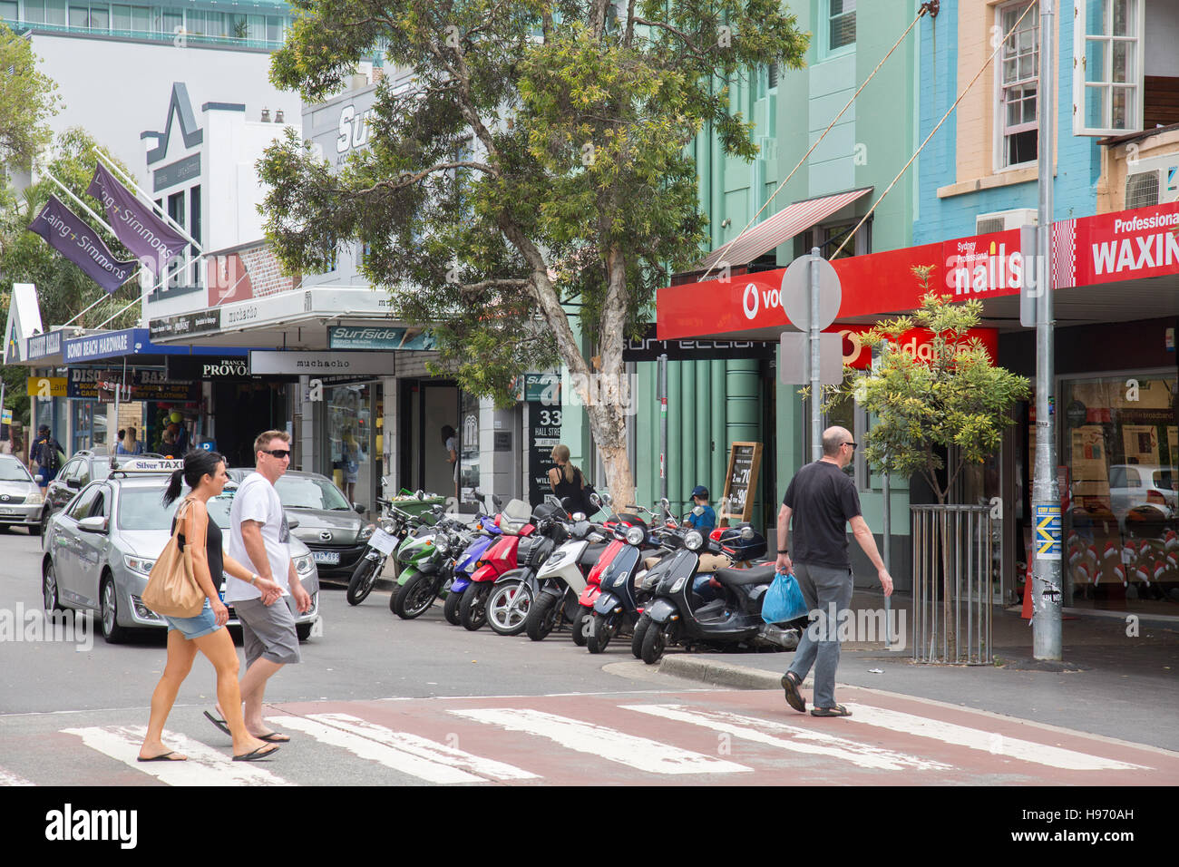 Bondi Beach suburb of Sydney, urban street scene with shops and stores ...
