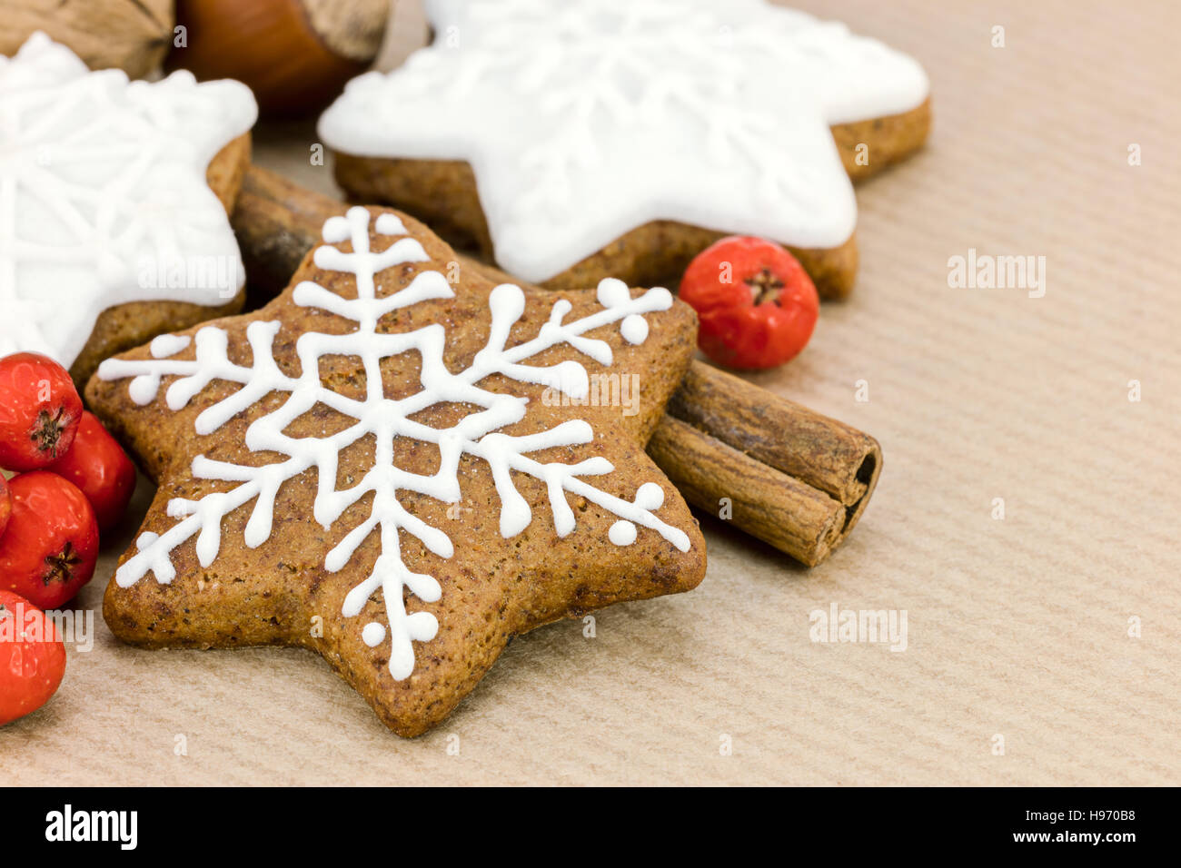 christmas homemade gingerbreads in star shape and red berries on ...