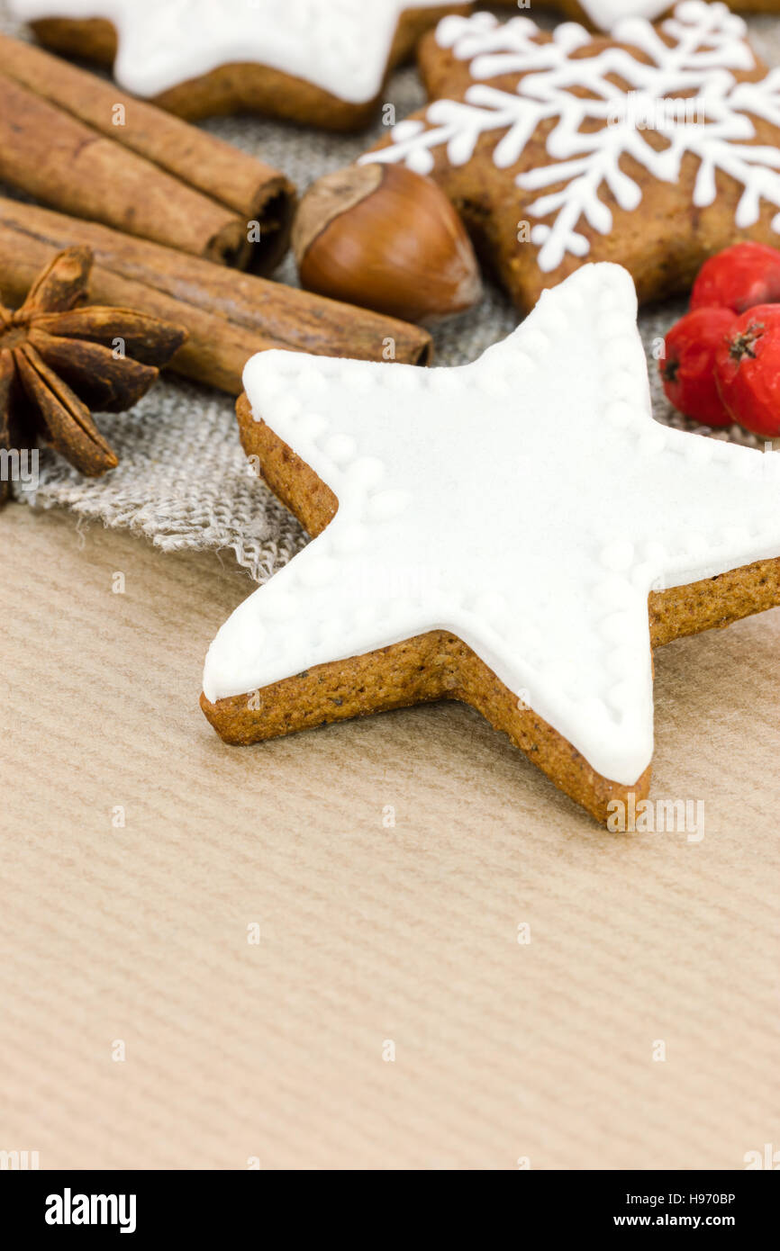christmas homemade star shaped gingerbread and red berries on brown ...