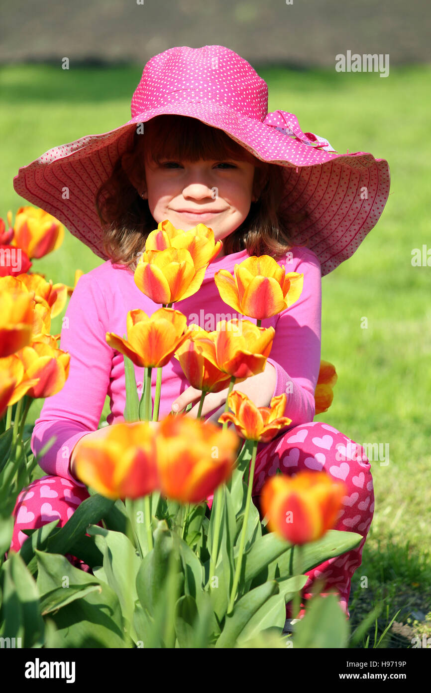 little girl with tulip flowers Stock Photo - Alamy
