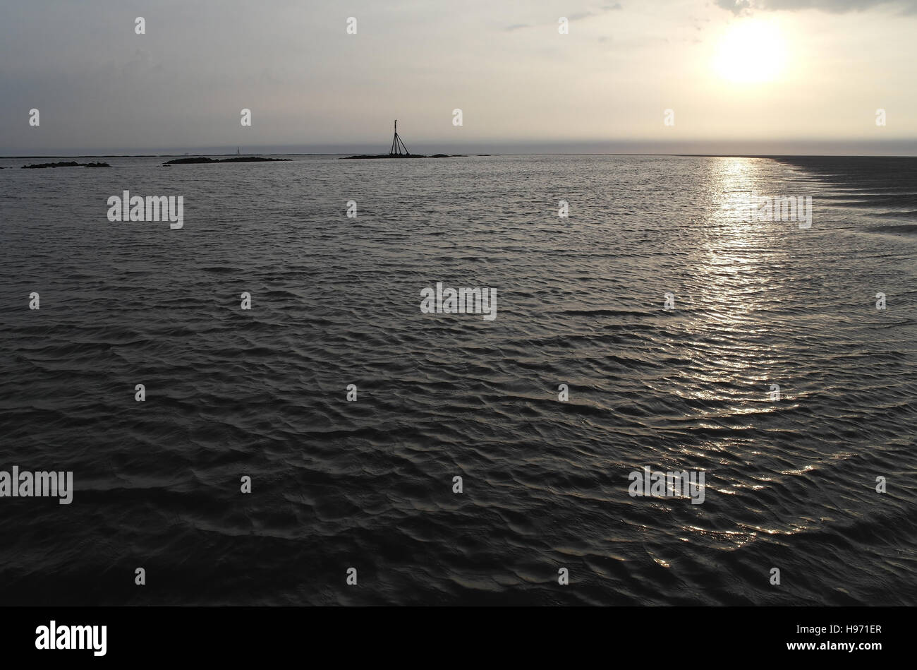 High tide flooded sand beach and partly submerged River Ribble North ...