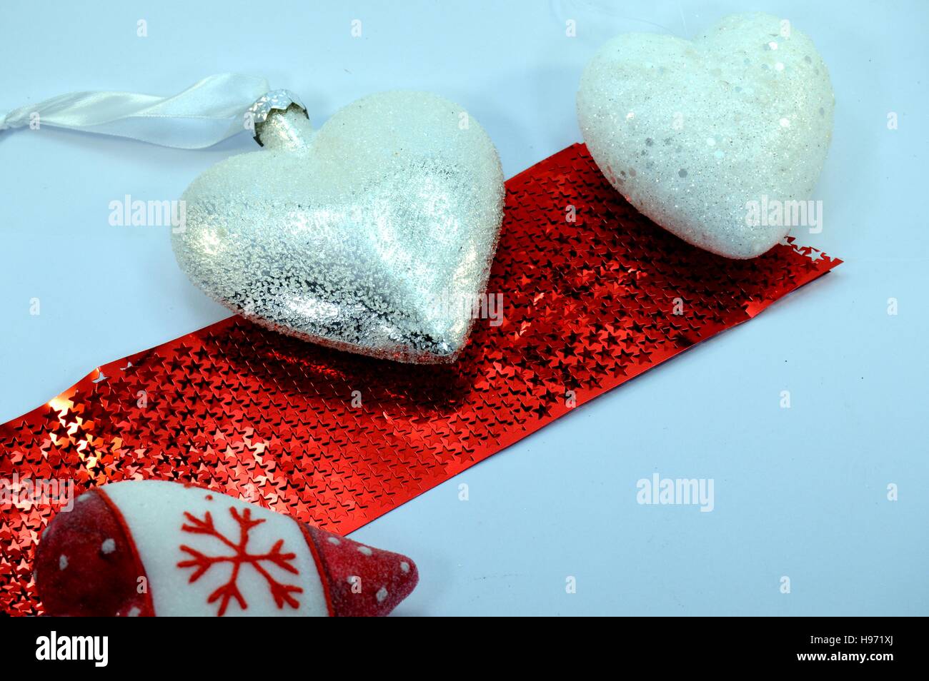Three white hearts on a red headband on white background Stock Photo ...