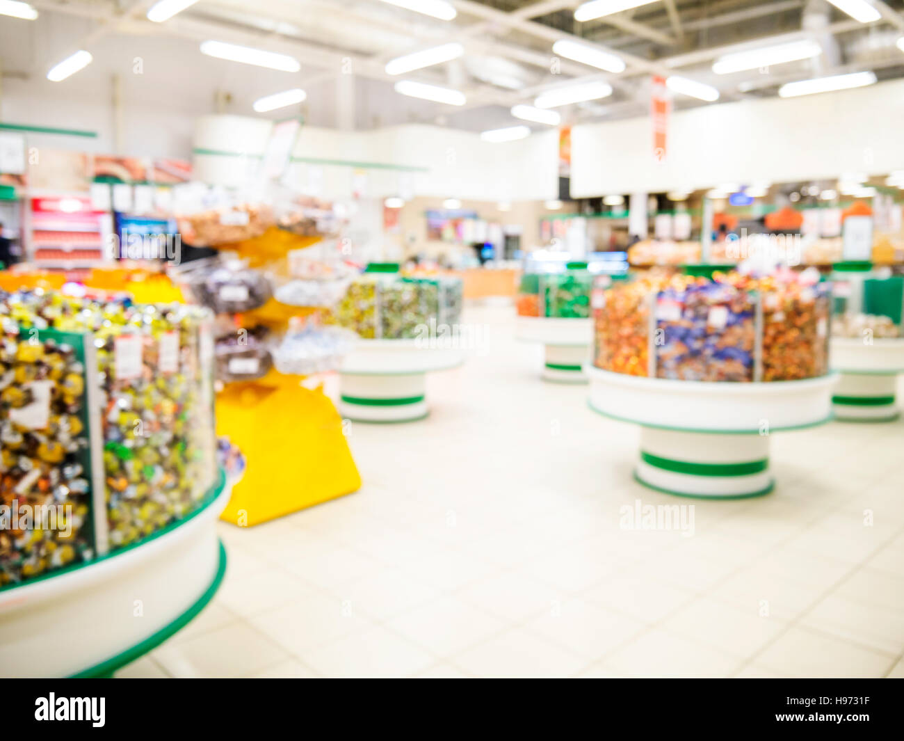 Abstract blurred supermarket aisle with colorful shelves as background ...