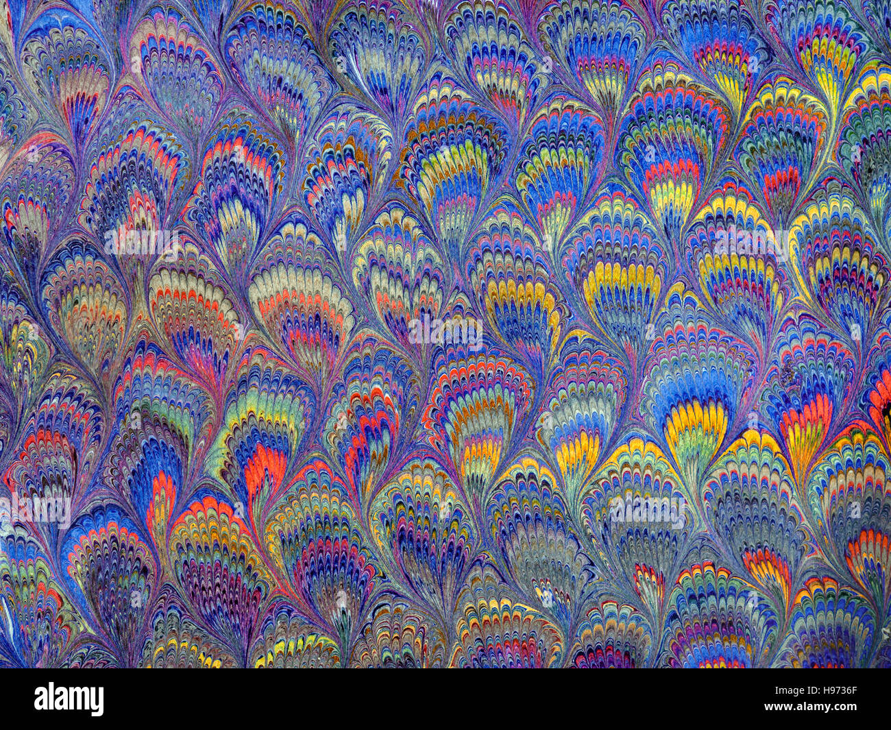 Hand made marbled paper with peacock feathers pattern Stock Photo - Alamy