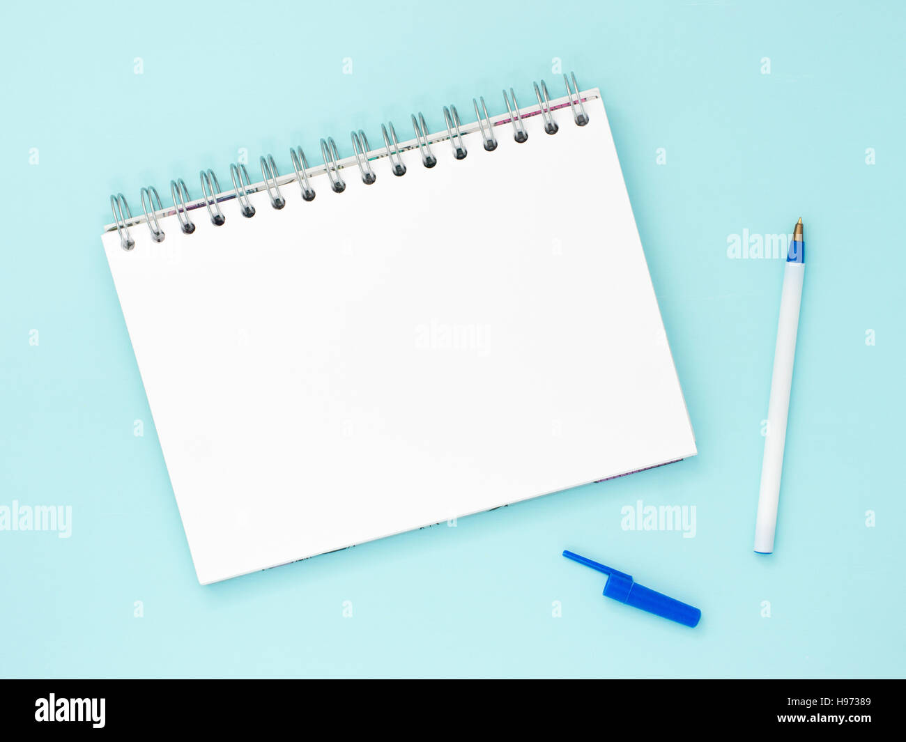 blank note paper on blue background Stock Photo - Alamy