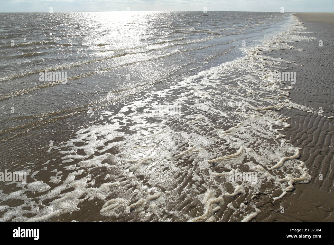 Seawater 1 calm expanse right mid distance extending right background ...