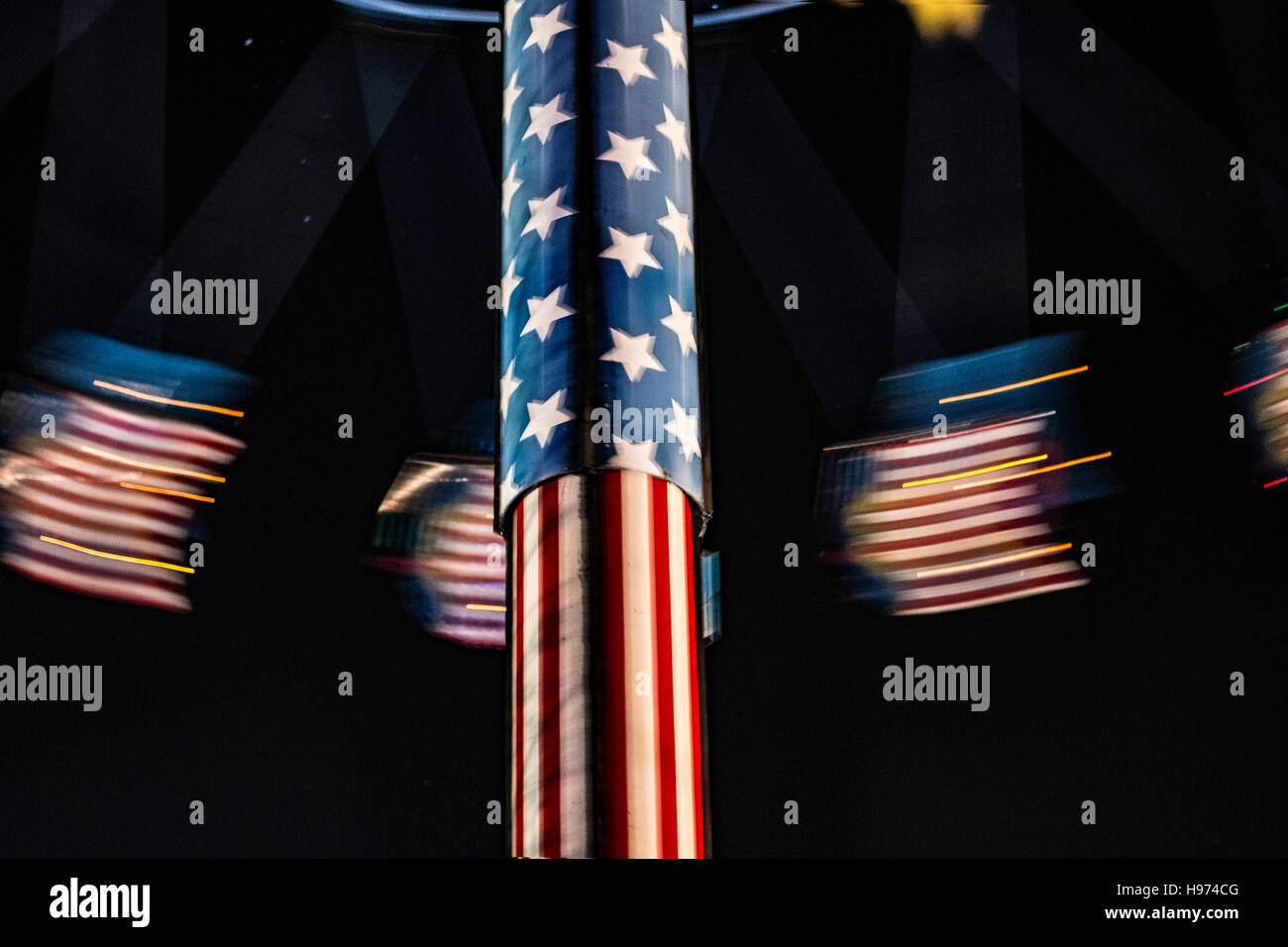 Spinning swing ride at night Stock Photo - Alamy