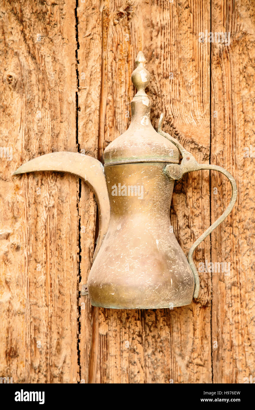 Ancient jug on the door on the narrow street of the old Riyadh Stock ...