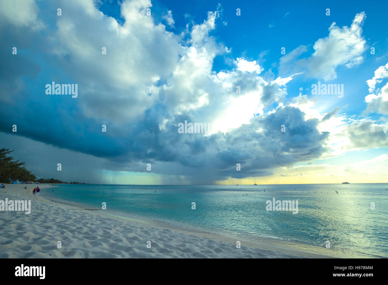 sunset over a tropical sea with golden sky and clouds Stock Photo - Alamy