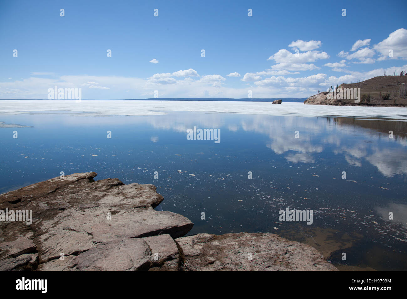 clear calm yellowstone lake in winter Stock Photo - Alamy