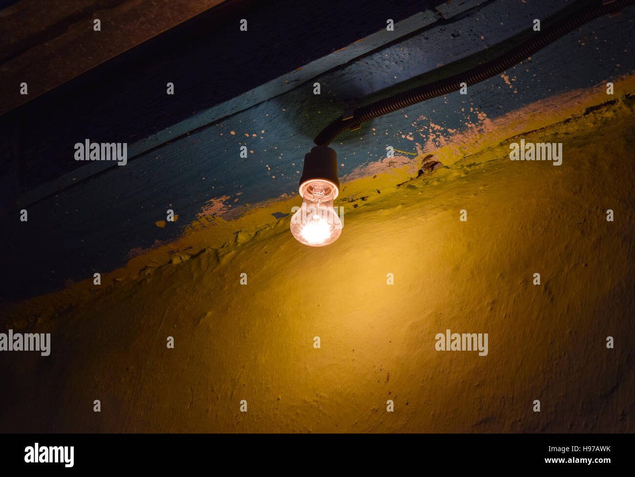 The yellowish light of incandescent lamps at dusk on the street. Light ...