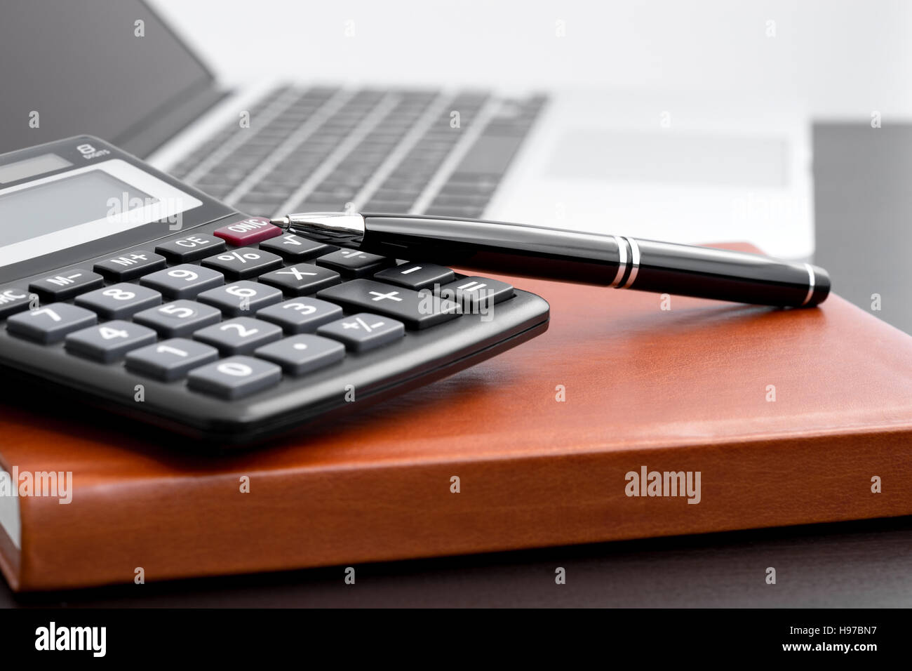 Office workplace with laptop and notepad Stock Photo - Alamy