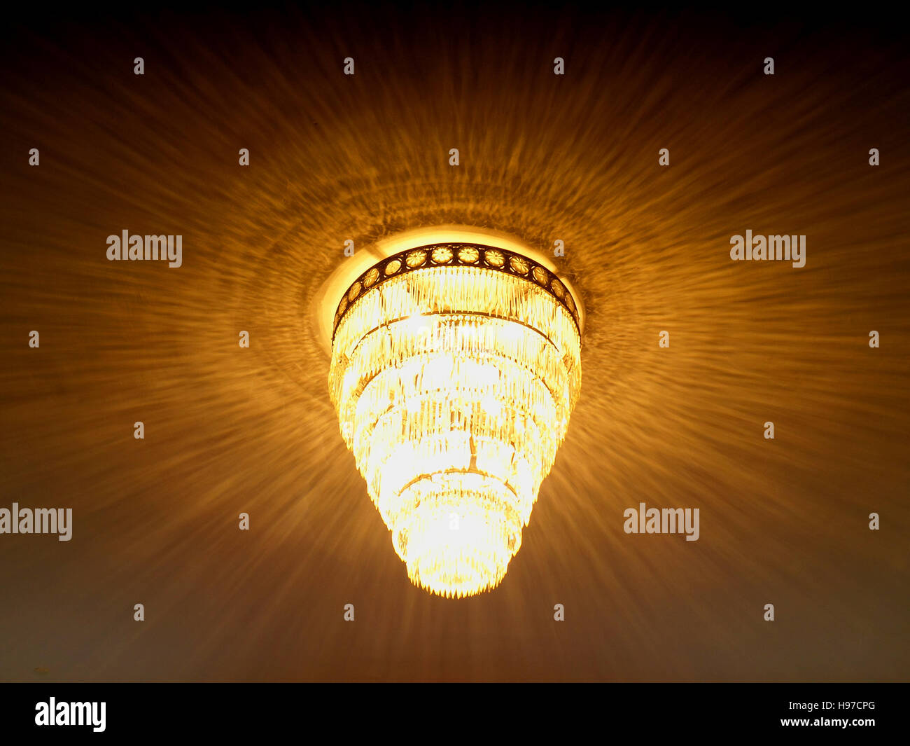 Chandelier with its beautiful reflection on the ceiling Stock Photo - Alamy