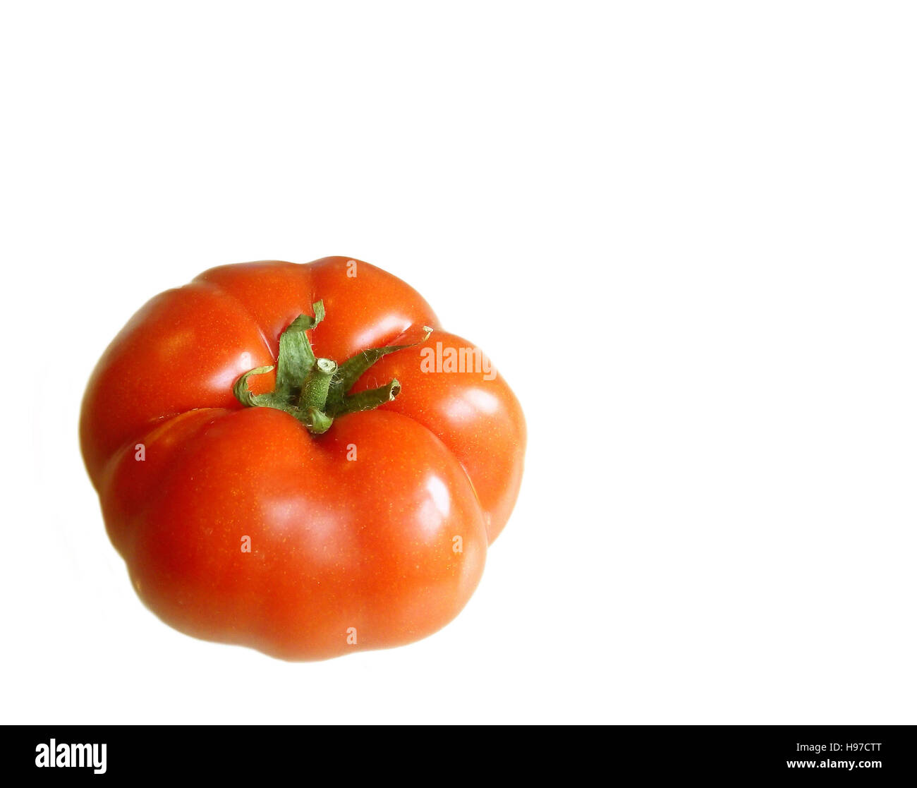 Close-up of One Ripe Fresh Red Tomato with green stem Isolated On White ...