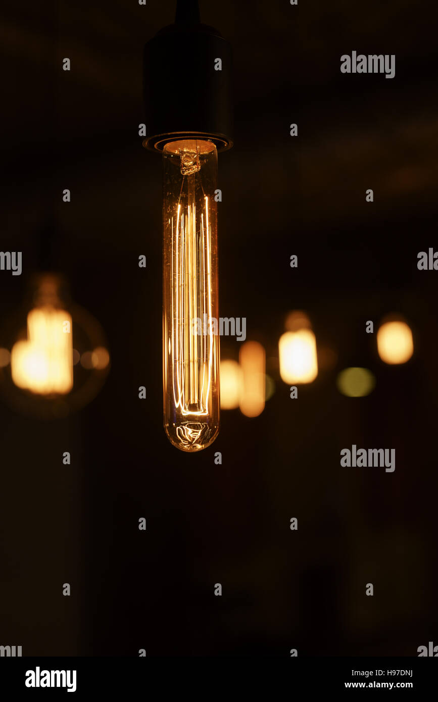 Image of elongated incandescent lamp, blur on background Stock Photo ...