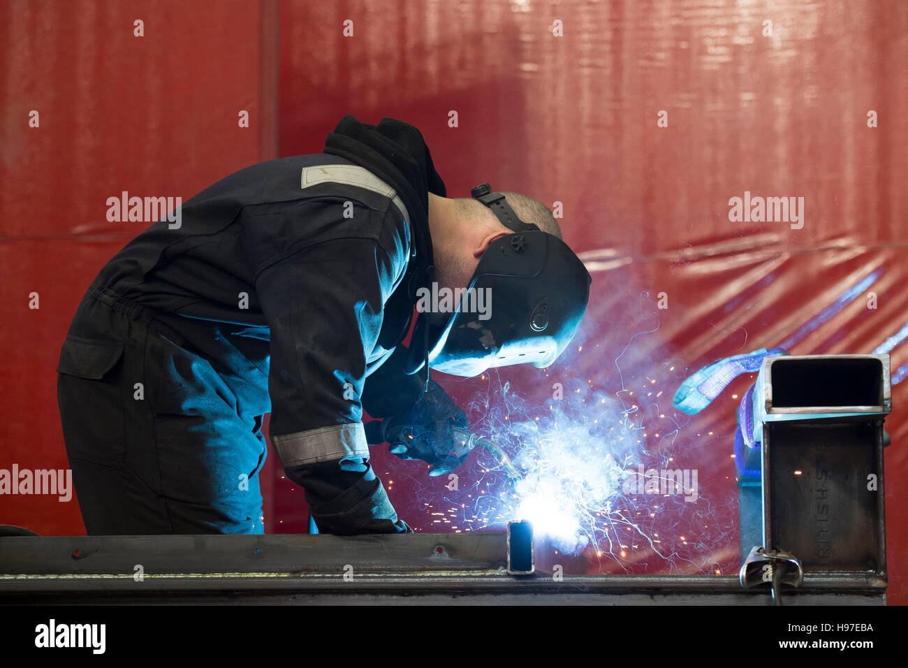 A male welder welding steel metal in a workshop Stock Photo - Alamy